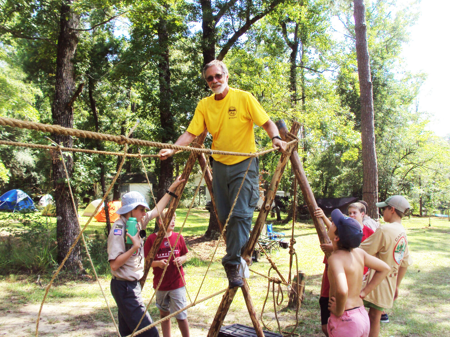 The author testing a Double A-Frame Monkey Bridge built by Troop 477 ...